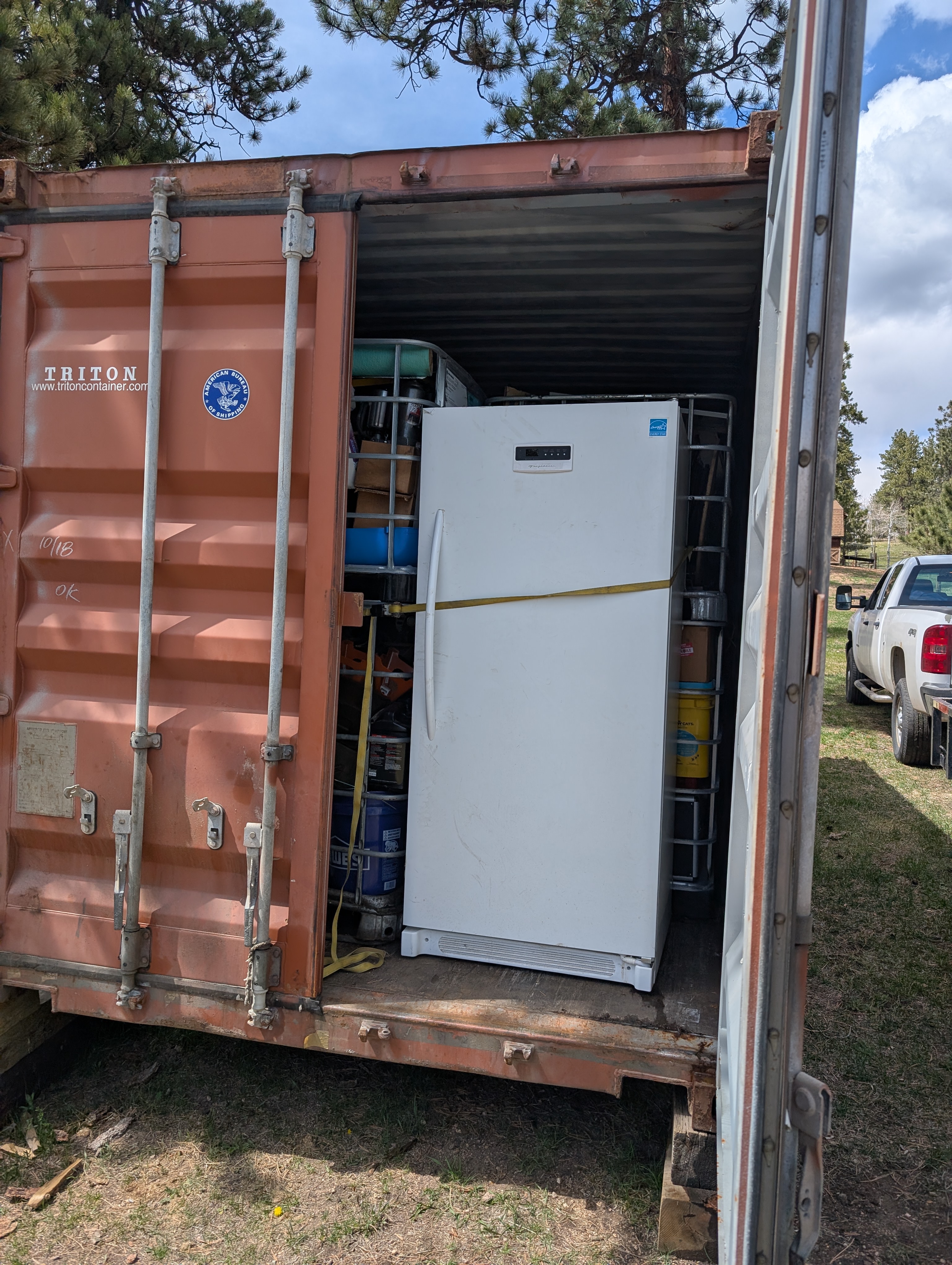 20 ft shipping container with approximately 9000 lbs of contents ...